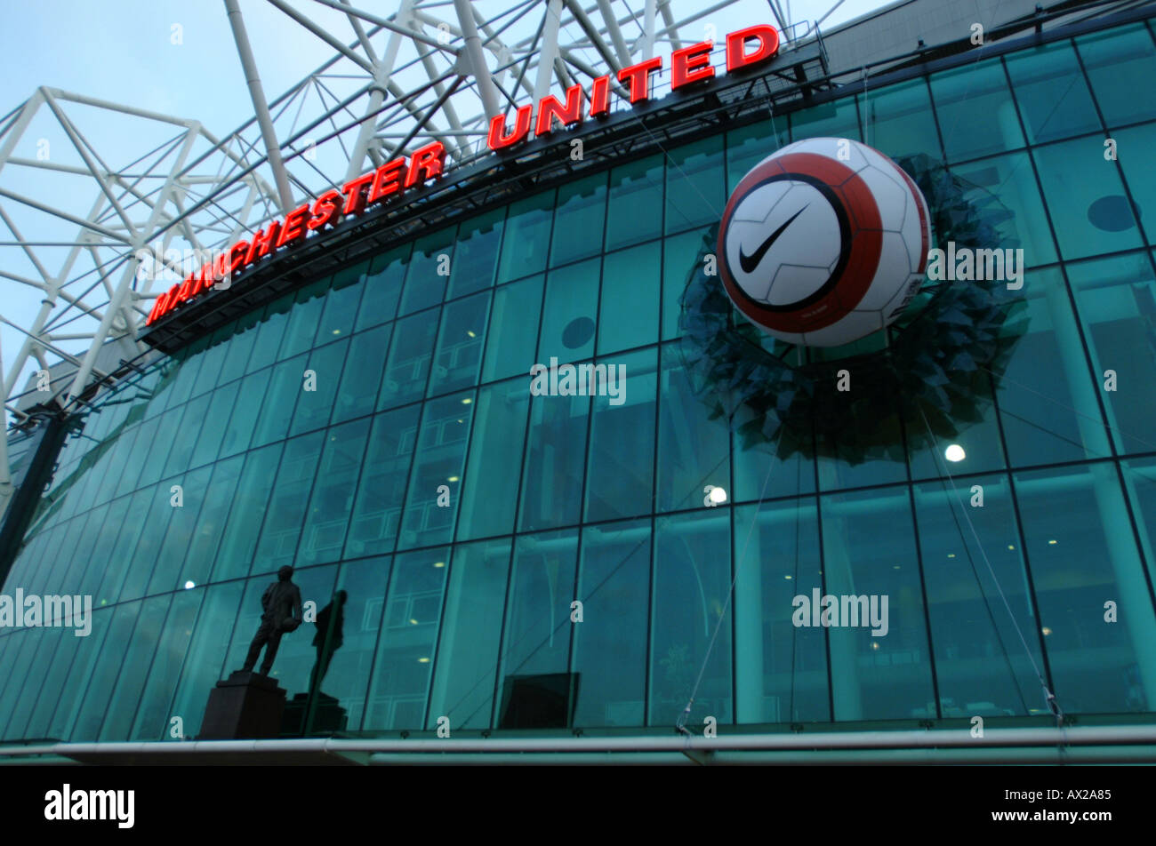 A giant football depicted breaking the window at old trafford football ...