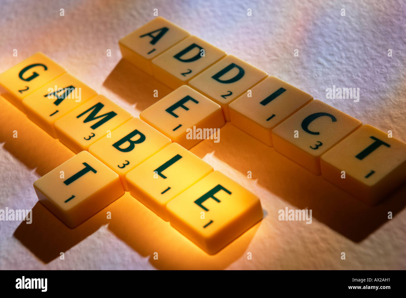 SCRABBLE BOARD GAME LETTERS SPELLING GAMBLE ADDICT DEBT Stock Photo - Alamy