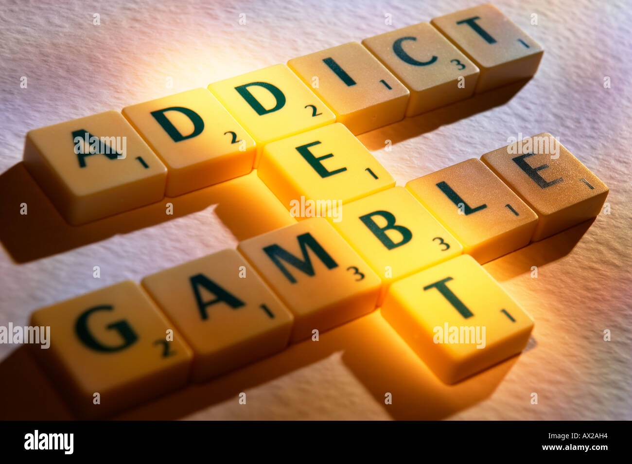 SCRABBLE BOARD GAME LETTERS SPELLING GAMBLE ADDICT DEBT Stock Photo - Alamy