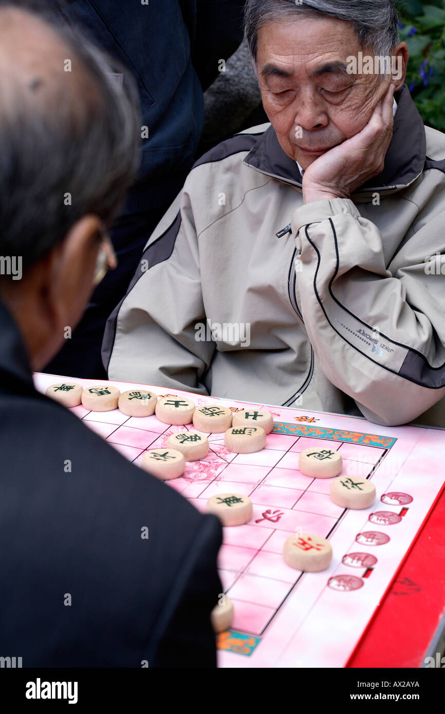 Two elderly Chinese males playing xiangqi/Chinese chess at the Mid ...