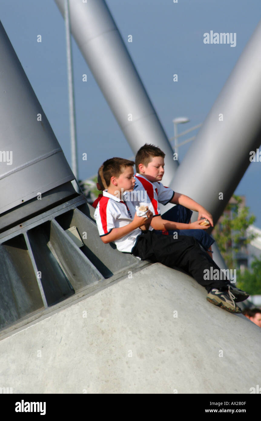 Two young england fans eat a snack before the Japan England football ...