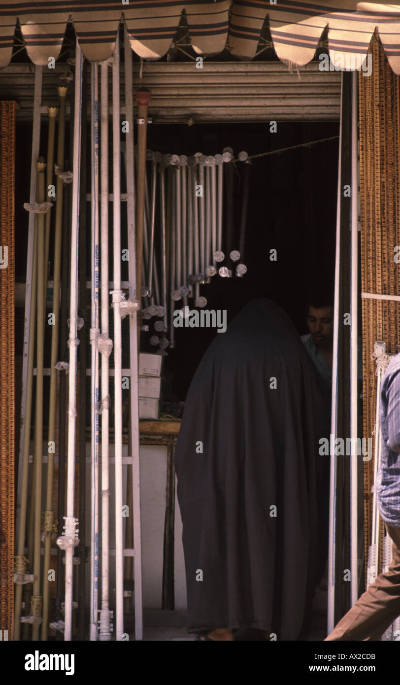Iraqi woman in black chador robe shopping in Baghdad Iraq Stock Photo ...