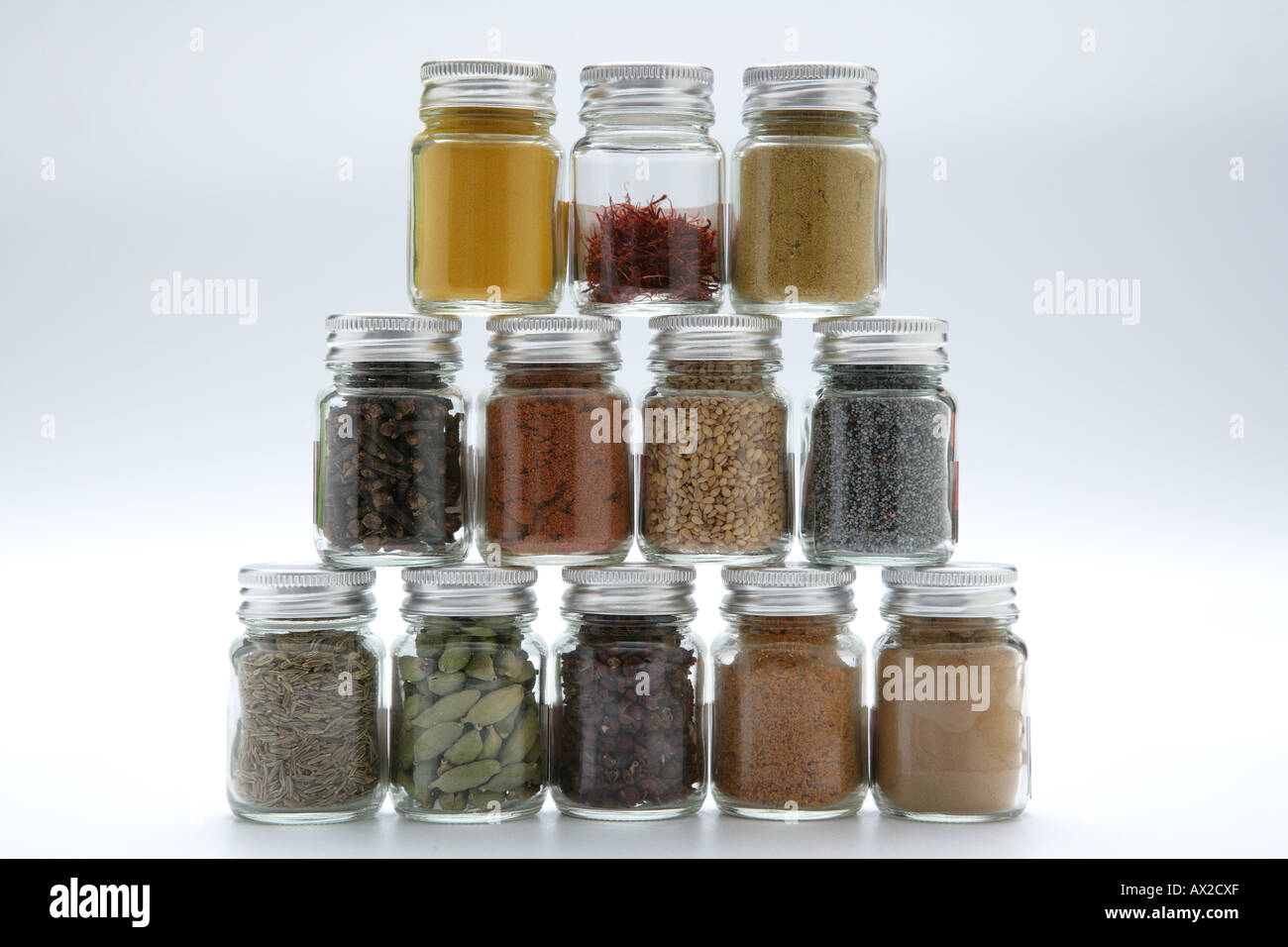 Glass flasks with assorted spices Stock Photo - Alamy