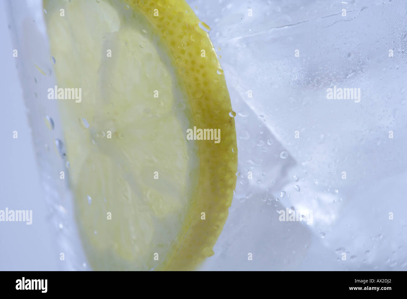 Glass with ice and lemon slice detail Stock Photo - Alamy