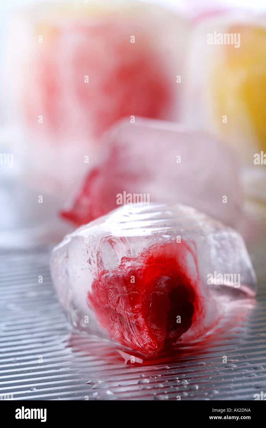 Raspberry into an ice cube Stock Photo - Alamy