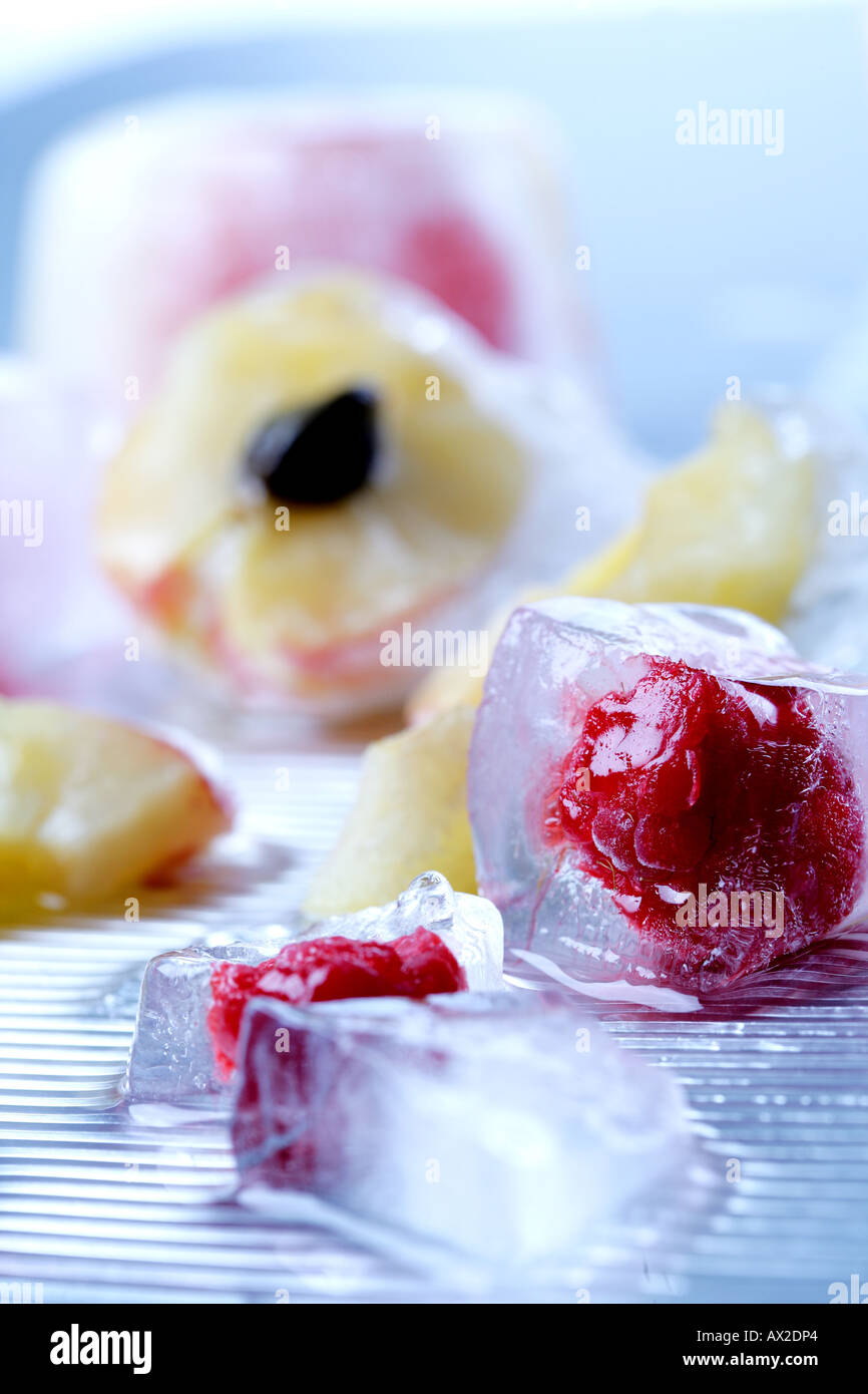 Frozen apricot and raspberries into a broken ice cubes Stock Photo - Alamy