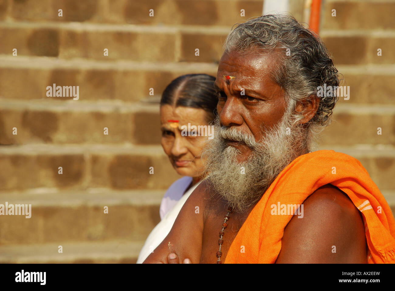 An indian poojari and his wife standing in frint of pdmanabha temple ...