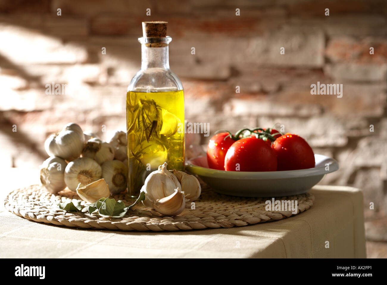 Mediterranean still life with natural light tomatoes olive oil bay ...