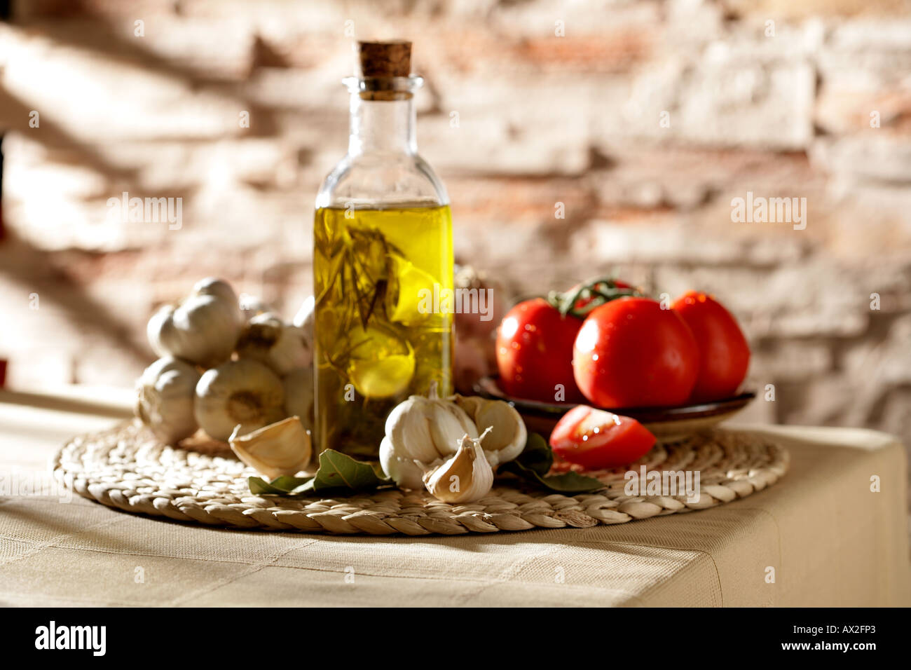 Mediterranean still life with natural light tomatoes olive oil bay ...