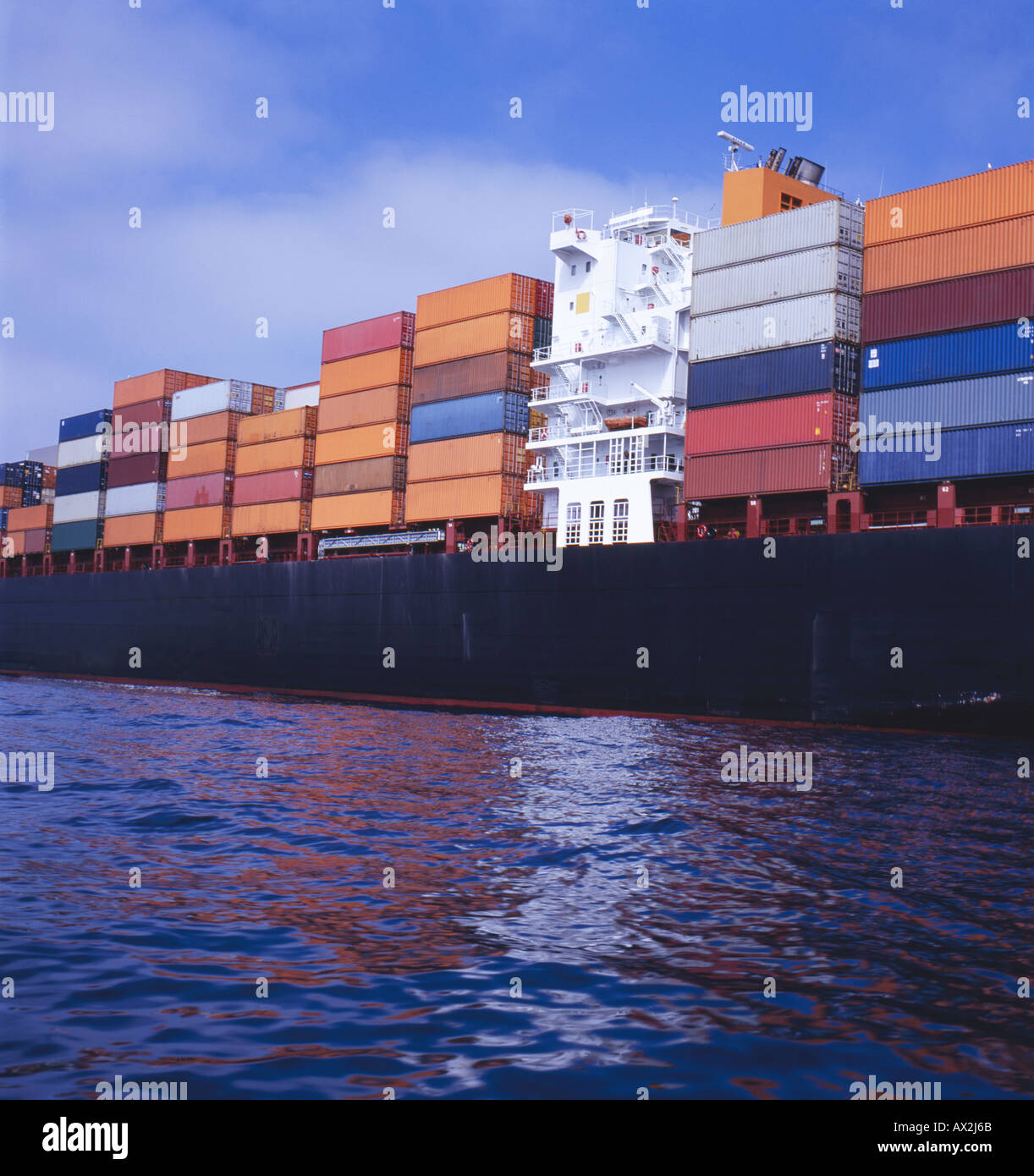 Freight containers stacked on dock Stock Photo - Alamy
