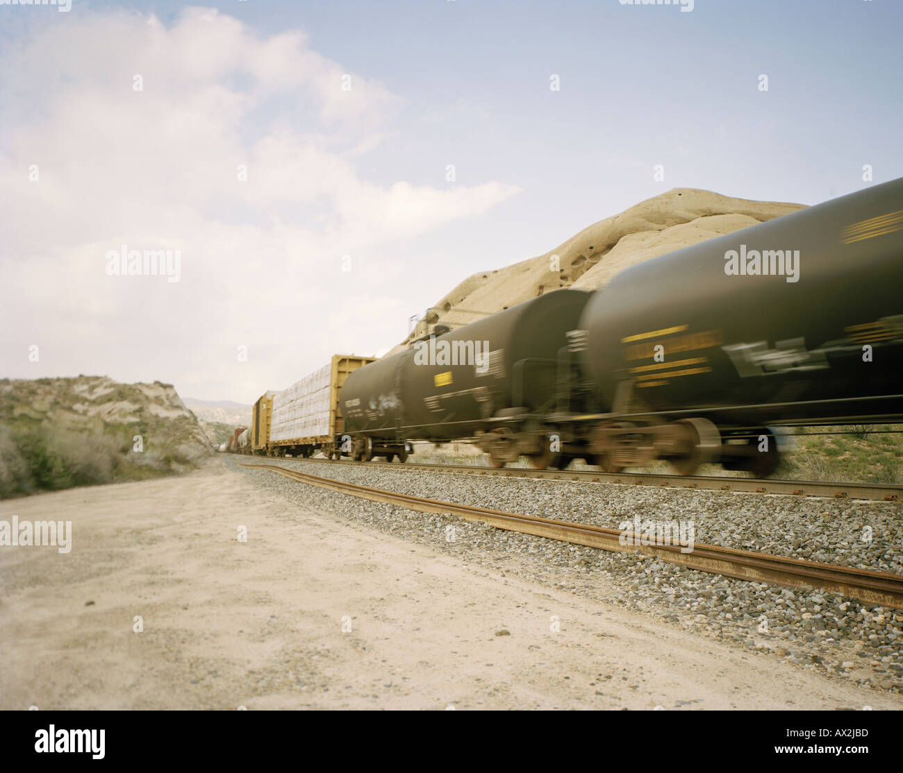 Freight train in motion Stock Photo - Alamy
