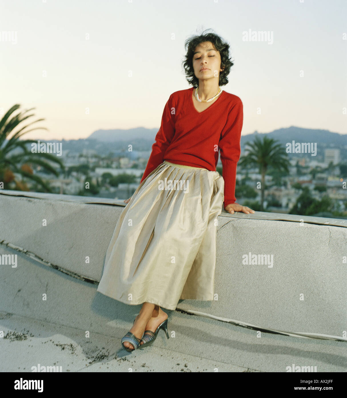 Woman sitting on ledge eyes hi-res stock photography and images - Alamy