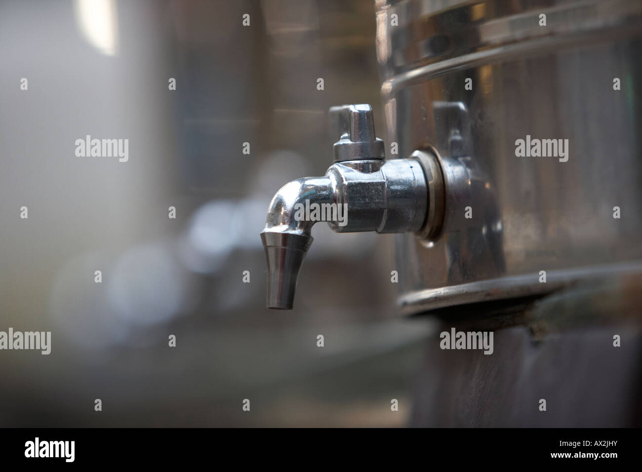 tap on an olive oil vat container in a row on a market stall Stock ...