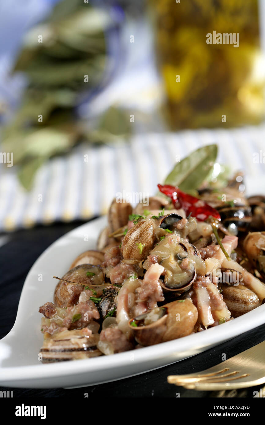 Snails stew with butifarra Catalonian sausage Stock Photo - Alamy