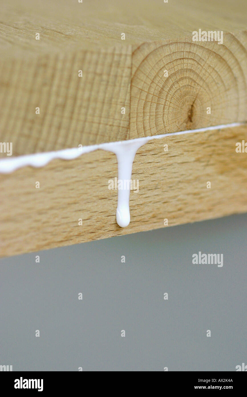 Glue oozing out from between two boards Stock Photo - Alamy