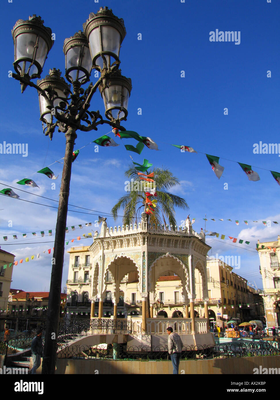 Old square and buildings from the french period, Central place of palm ...