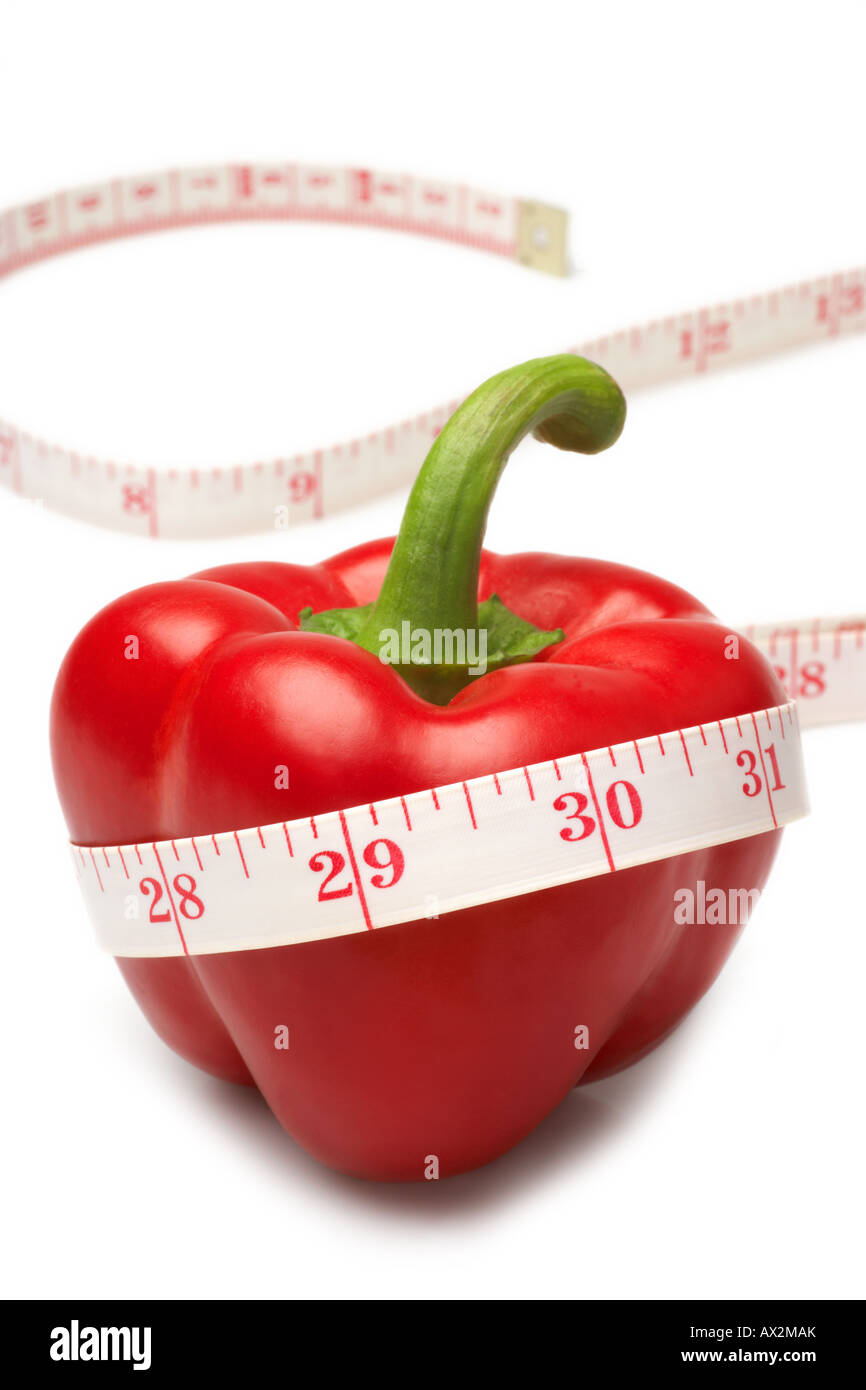 Red Pepper with tape measure indicating weight loss Stock Photo - Alamy
