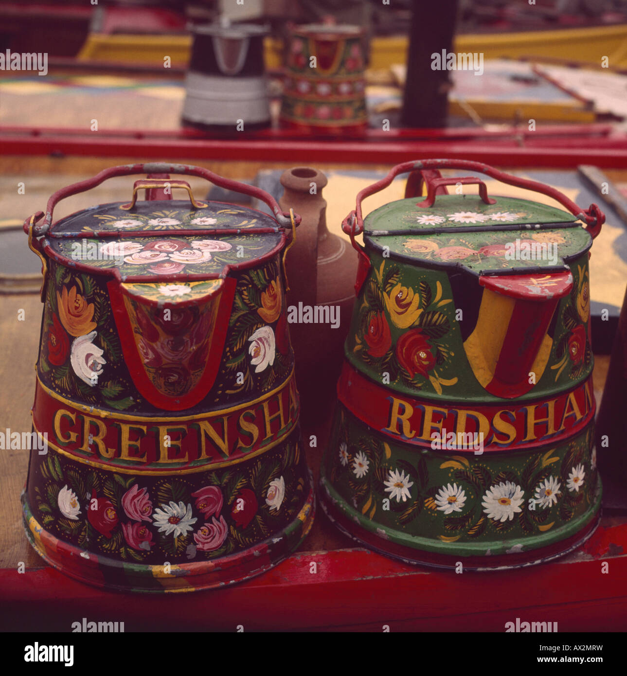 Close up of traditional floral decorated water cans on narrow boat ...