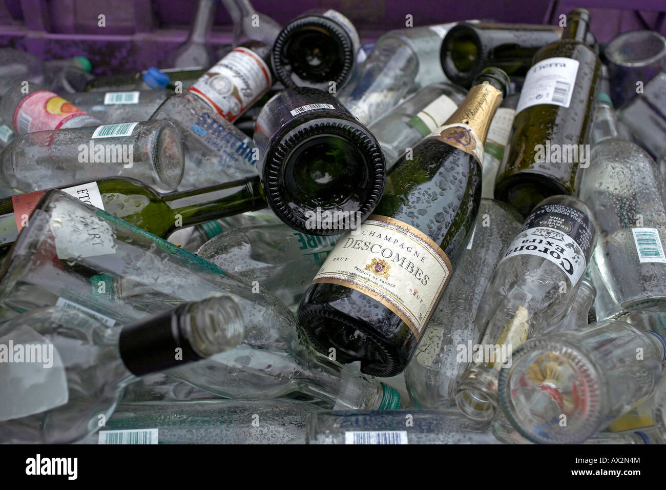 White & Green glass bottles in waste skip Stock Photo - Alamy