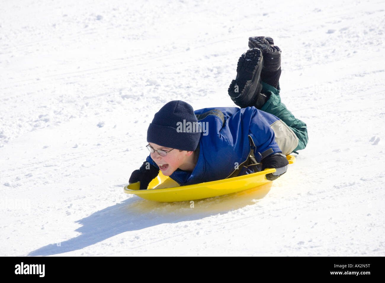 Boy Snow Sledding Stock Photo - Alamy