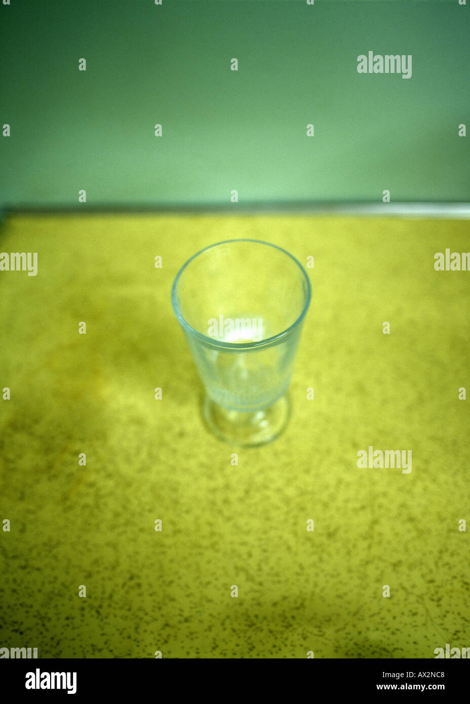 Empty glass on counter top Stock Photo - Alamy