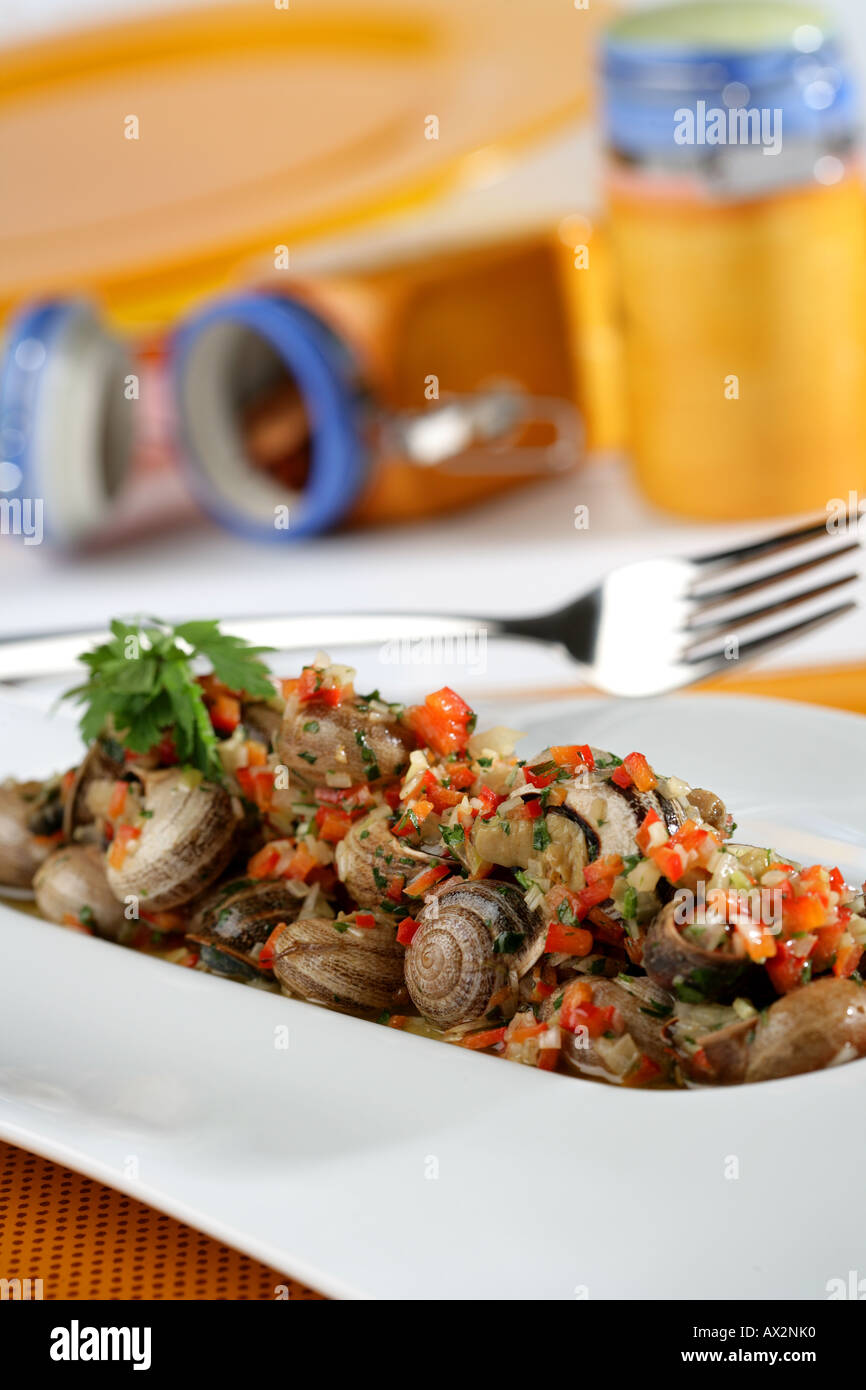Boiled snails with vinaigrette sauce Stock Photo - Alamy
