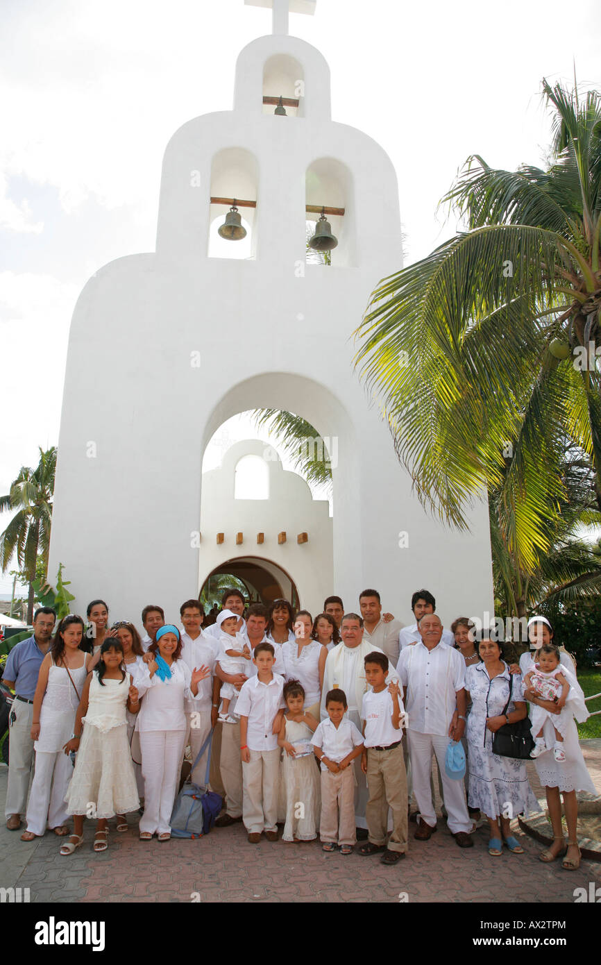 Family and friends in front of church with priest, Playa del Carmen ...