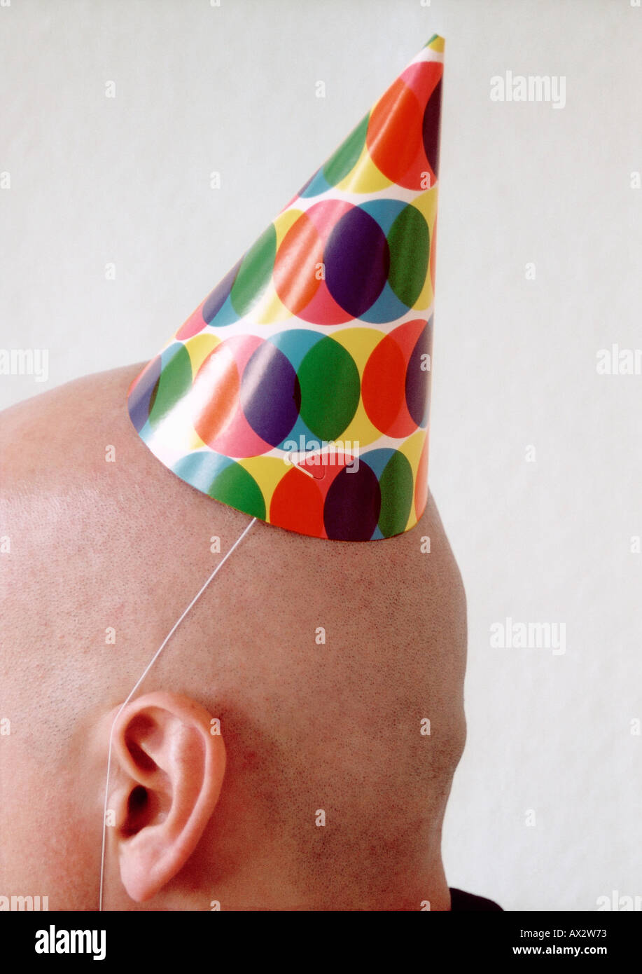 Man wearing party hat Stock Photo - Alamy