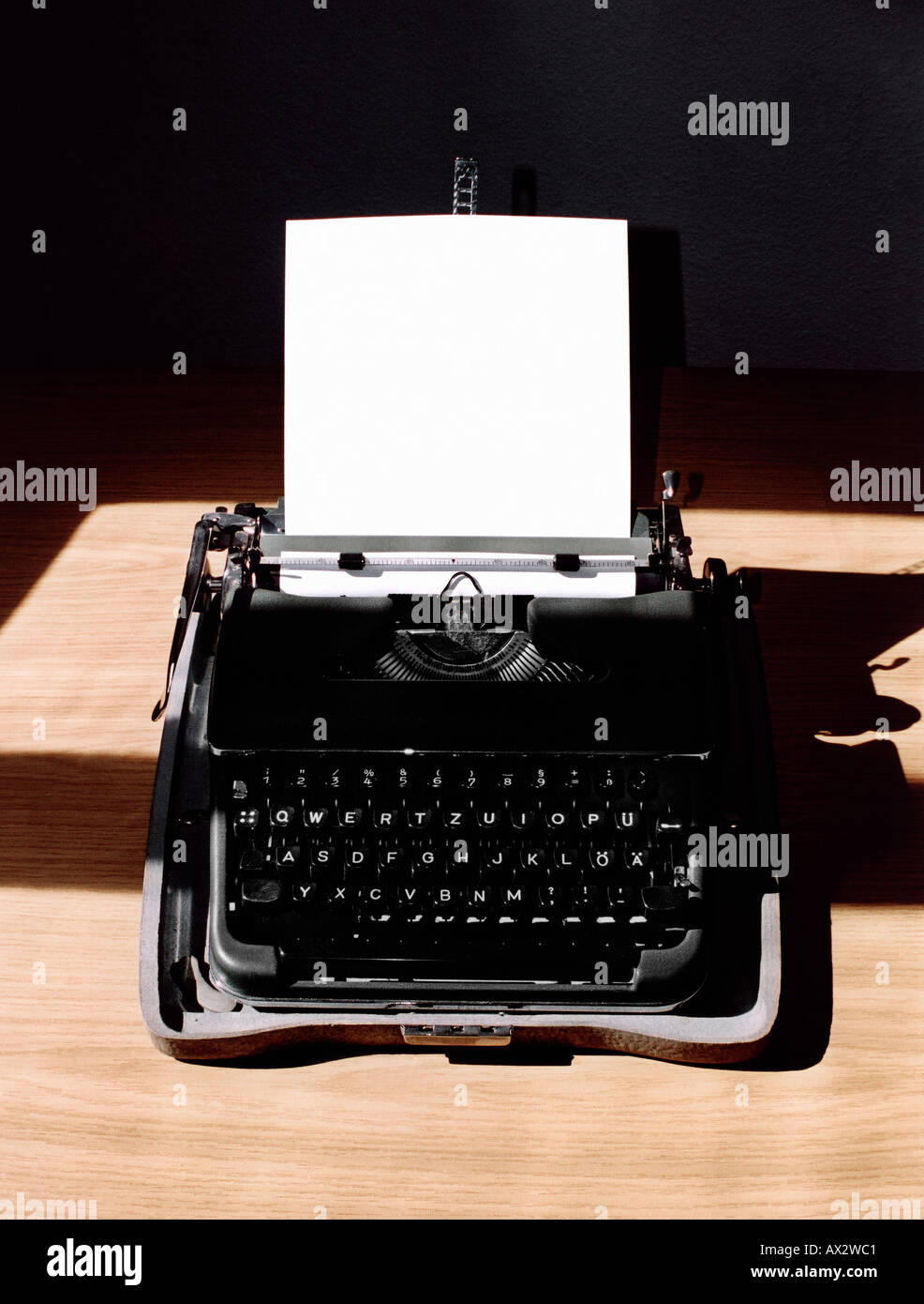 Paper in antique typewriter Stock Photo - Alamy