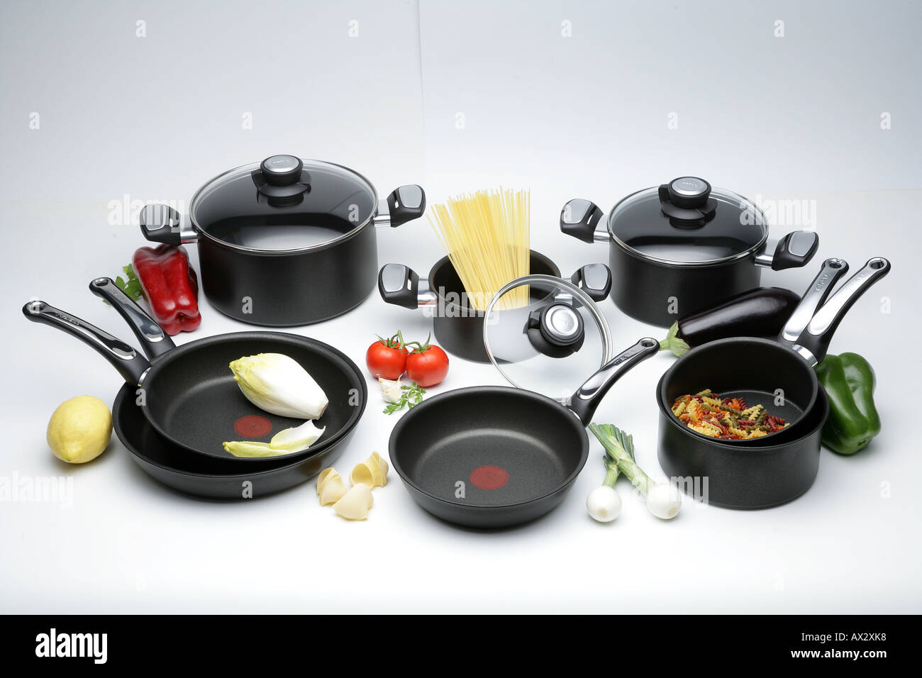 Nonstick kitchenware still life on white background with products ...