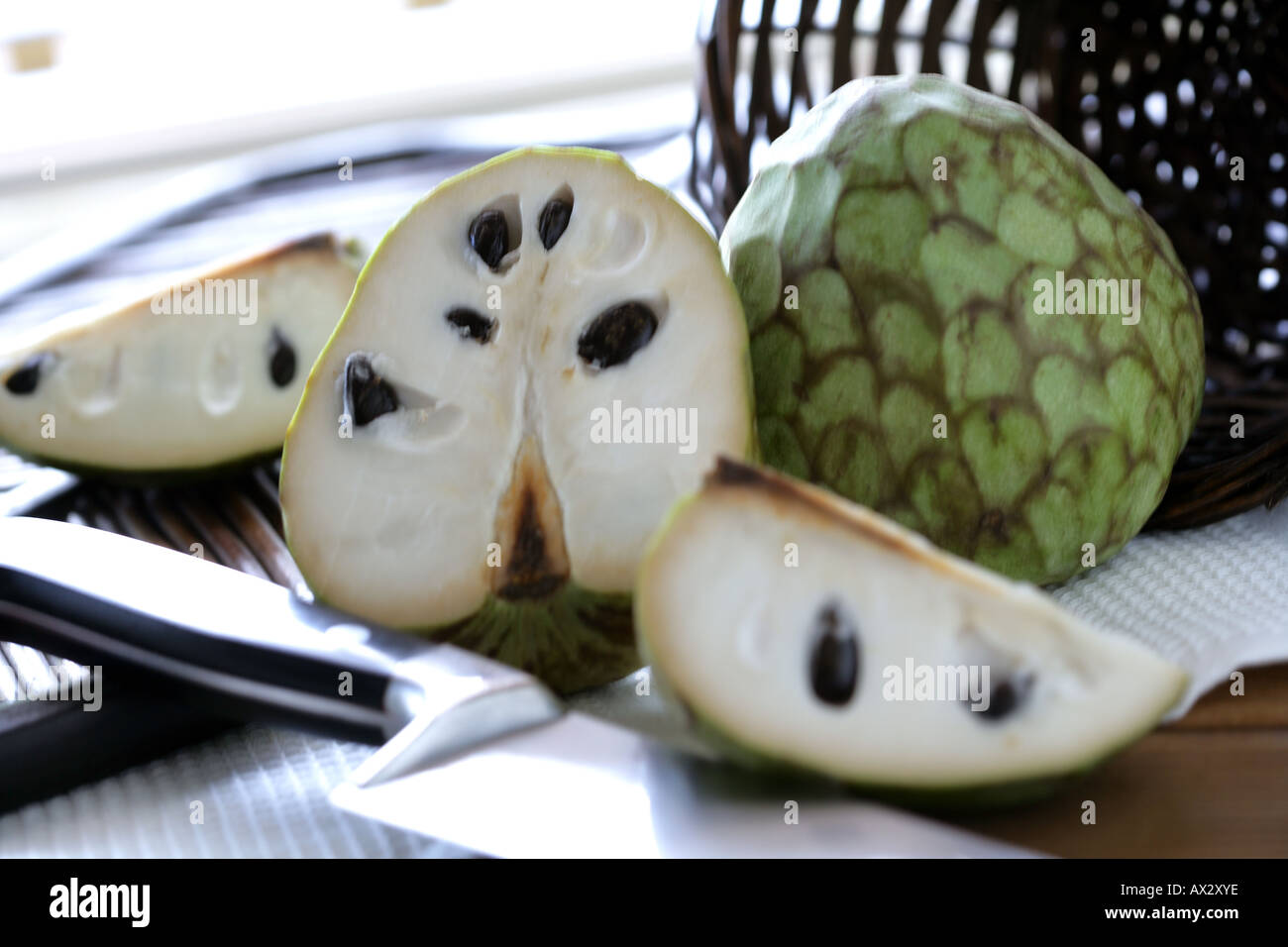 Two custard apples one opened Stock Photo - Alamy