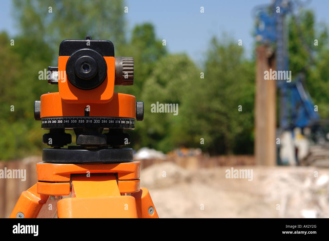 Theodolite next to construction site Stock Photo - Alamy