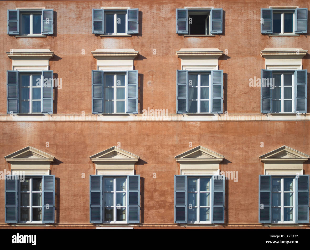 Windows and coloured walls in Rome Stock Photo - Alamy