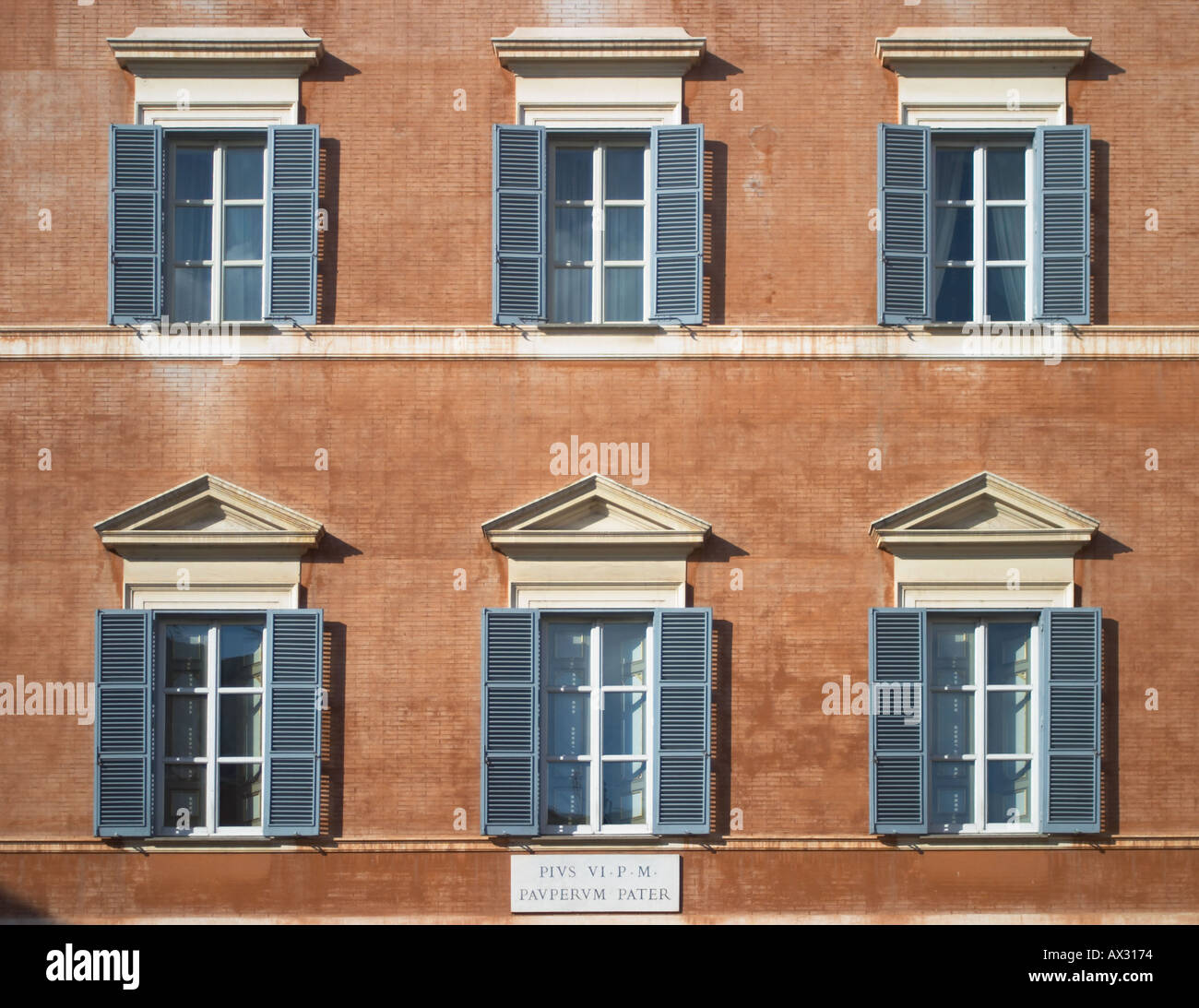 Windows and coloured walls in Rome Stock Photo - Alamy