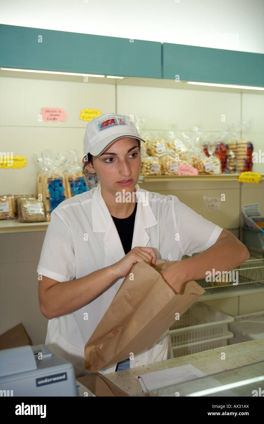 bakerman packing bread Stock Photo - Alamy
