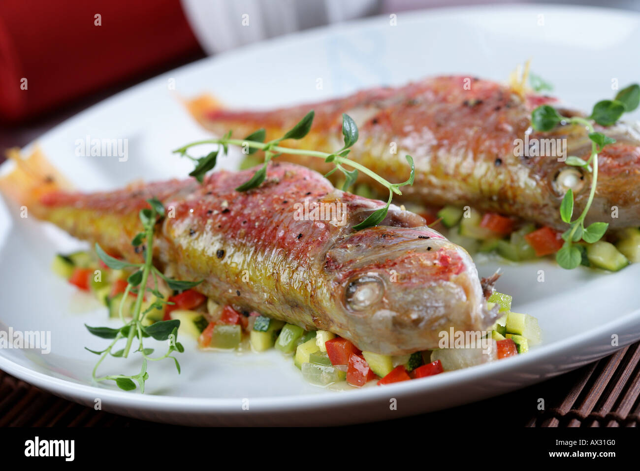 baked red mullets with thyme Stock Photo - Alamy