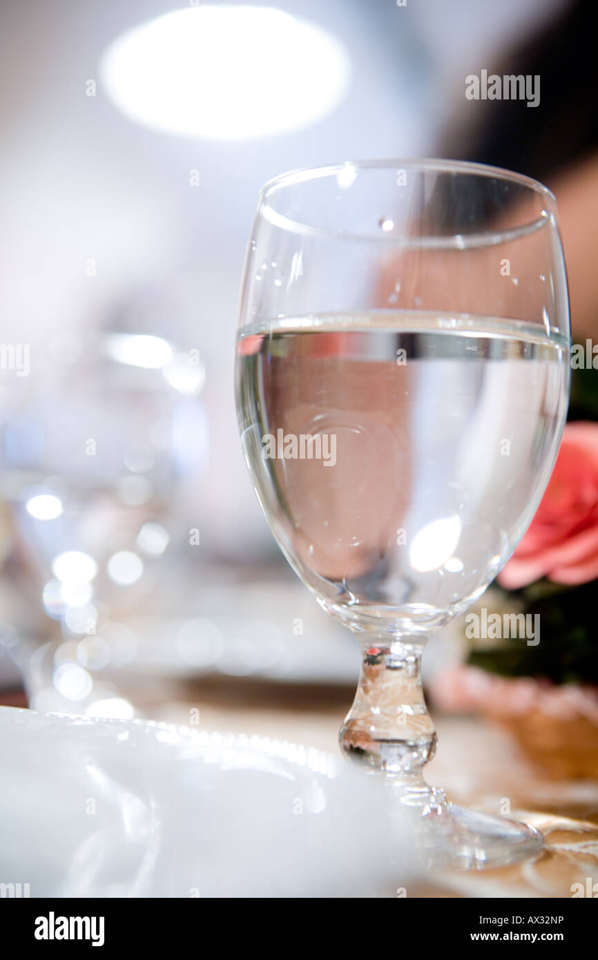 a glass of water on a setted table Stock Photo - Alamy
