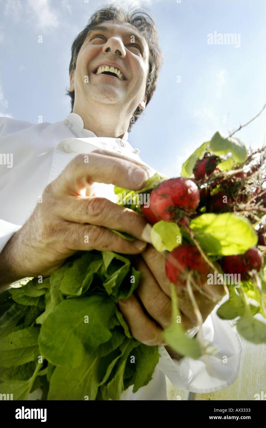 The chef Raymond Blanc with a handful of radishes in the grounds of the ...