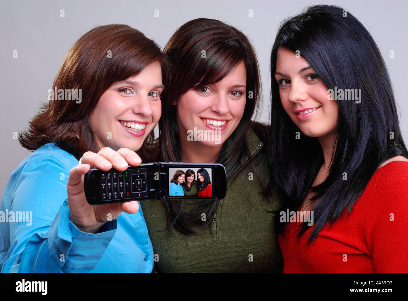 Group Of Three Girl Friends Taking A Selfie Photo with a mobile ...