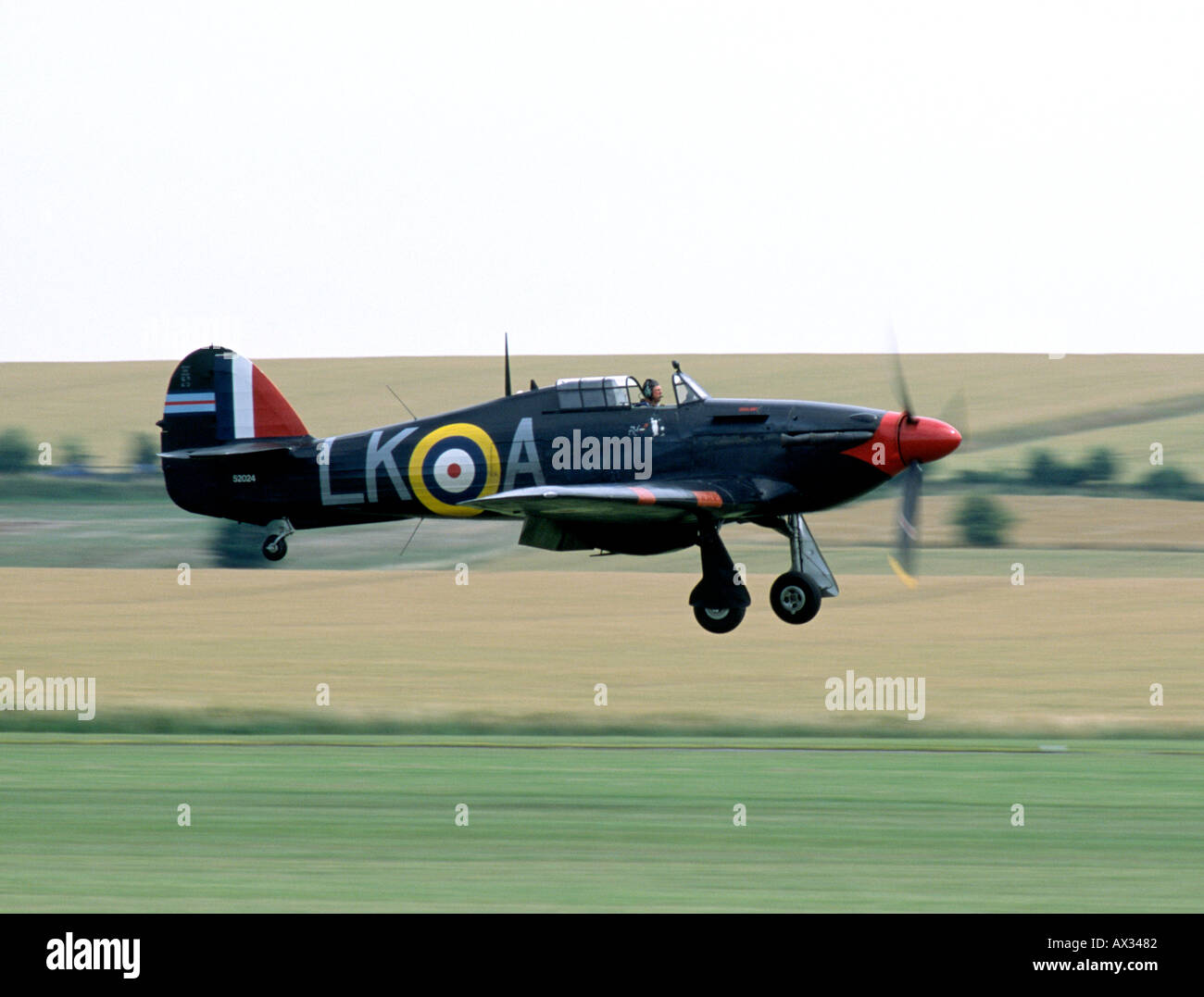 A Rolls Royce Griffon powered Hurricane taking off from the grass at ...