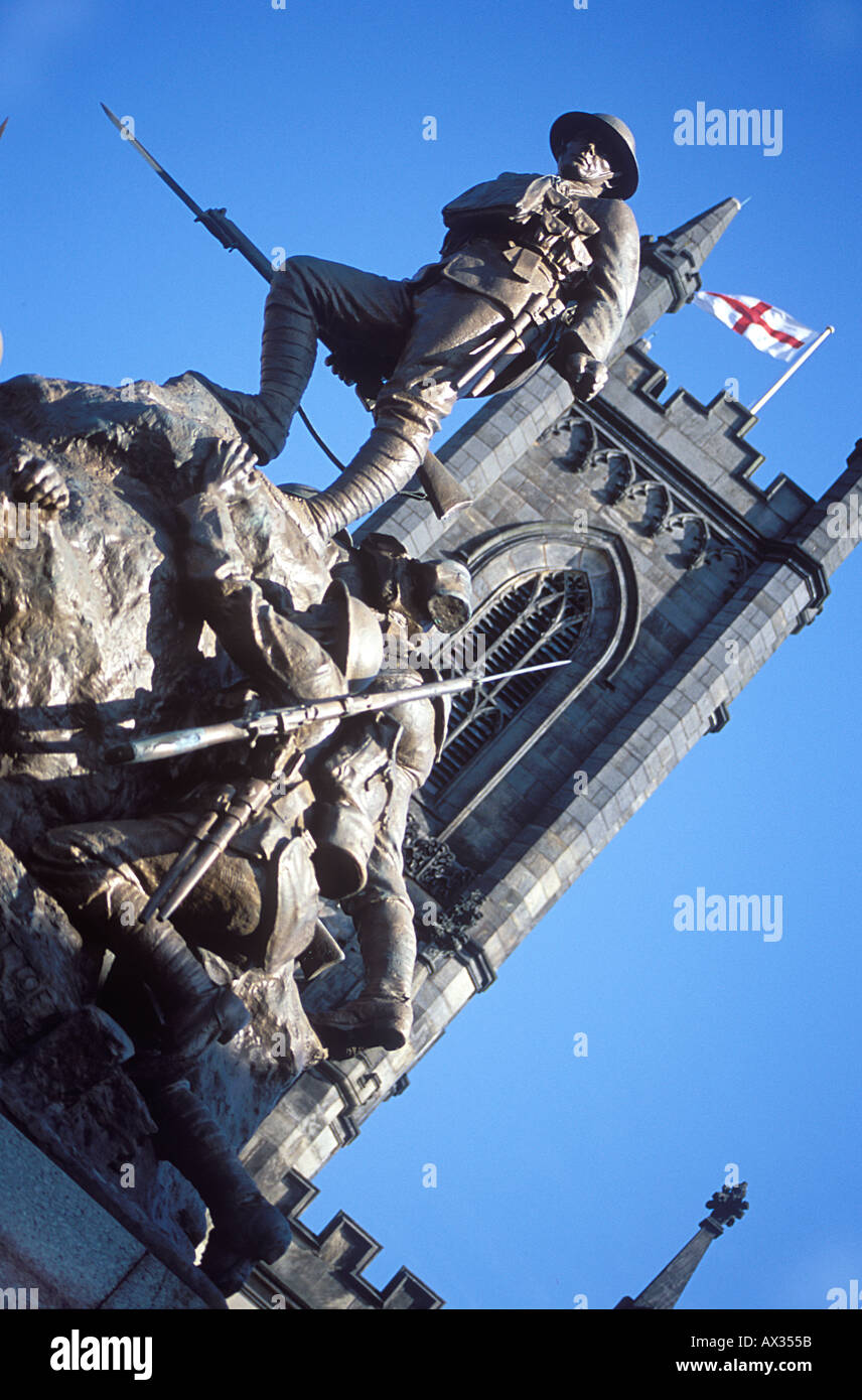 Detail shot of the war memorial Oldham UK with the Parish Church behind ...
