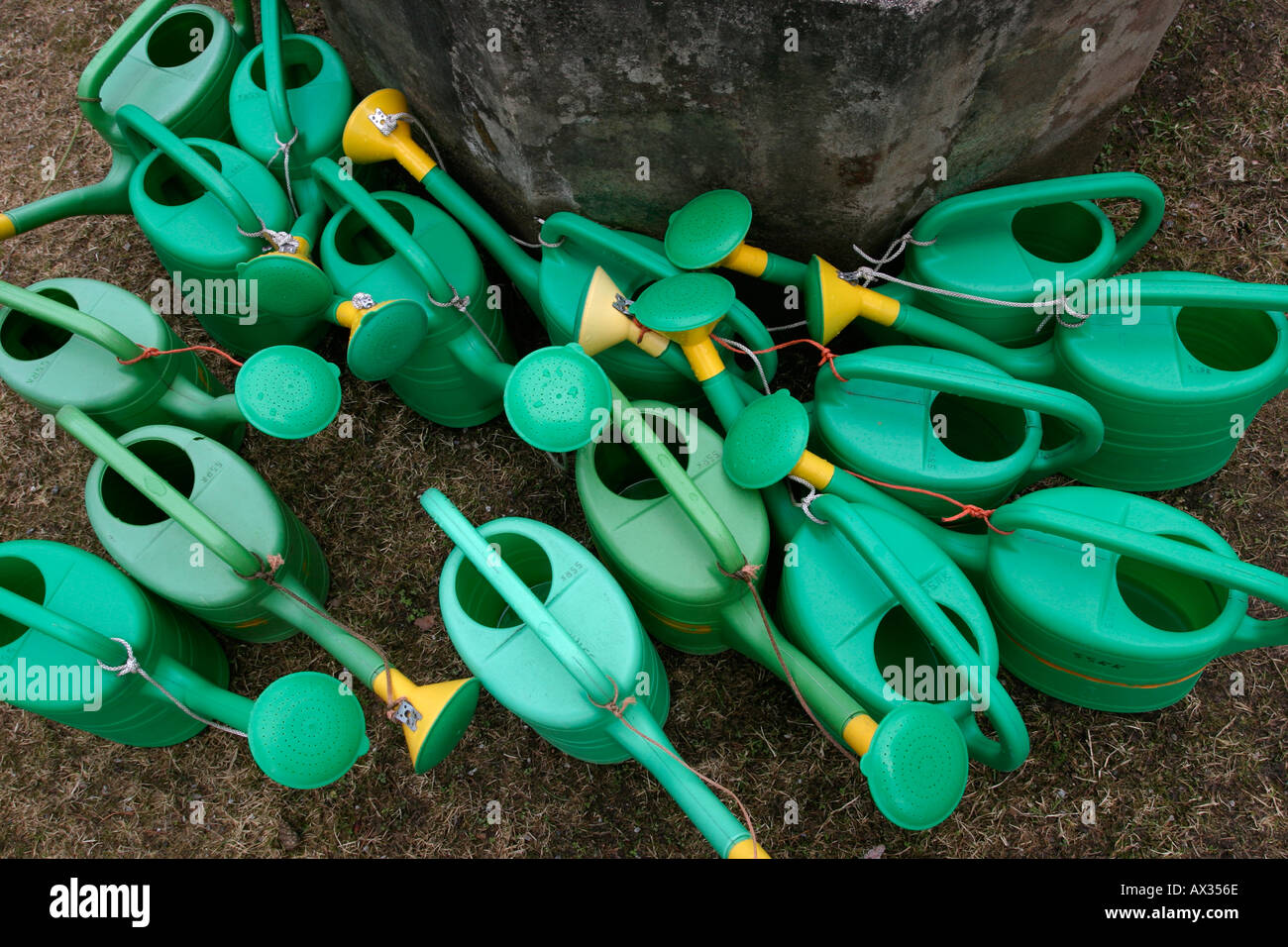 group of green watering cans Stock Photo - Alamy