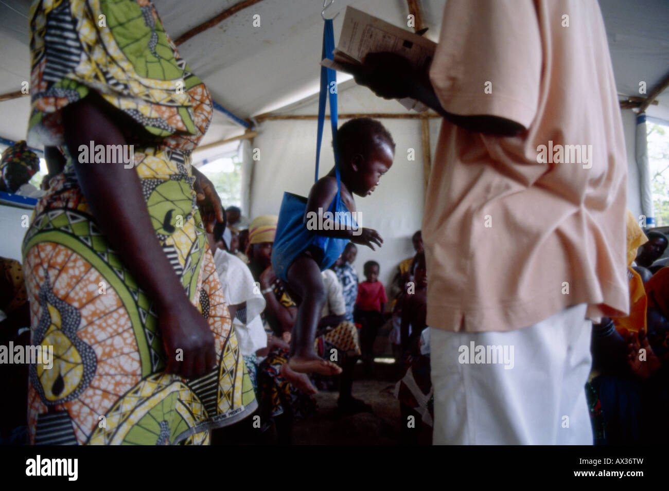 Weighing a baby at lugufu refugee camp, tanzania Stock Photo - Alamy
