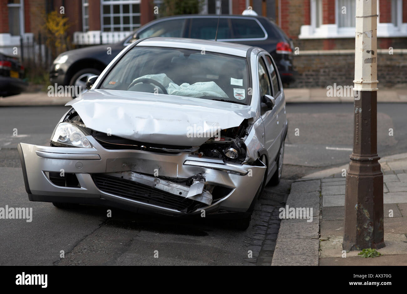 Small family car,impacted by head on collision with another vehicle ...