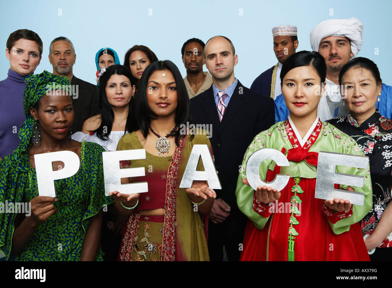 Multi-ethnic people holding the word PEACE Stock Photo - Alamy