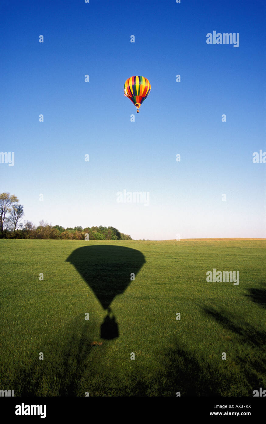 Hot Air Balloon in the Sky and Shadow of a Hot Air Balloon on the ...