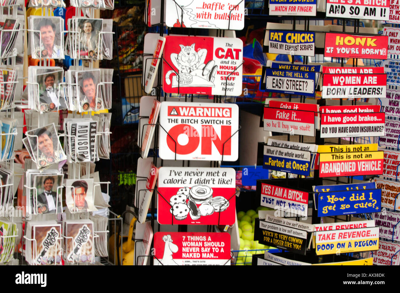 postcards and tacky comical gifts on sale at a seaside shop gift ...