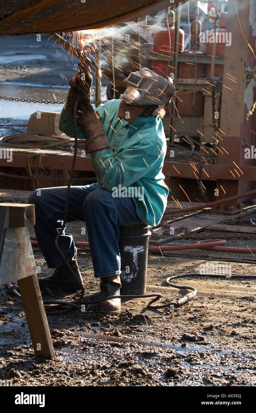 welder under ship Stock Photo - Alamy