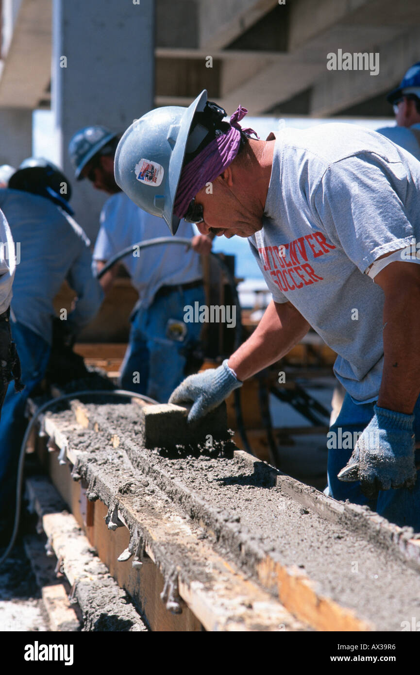 Construction worker smoothing concrete USA Stock Photo - Alamy