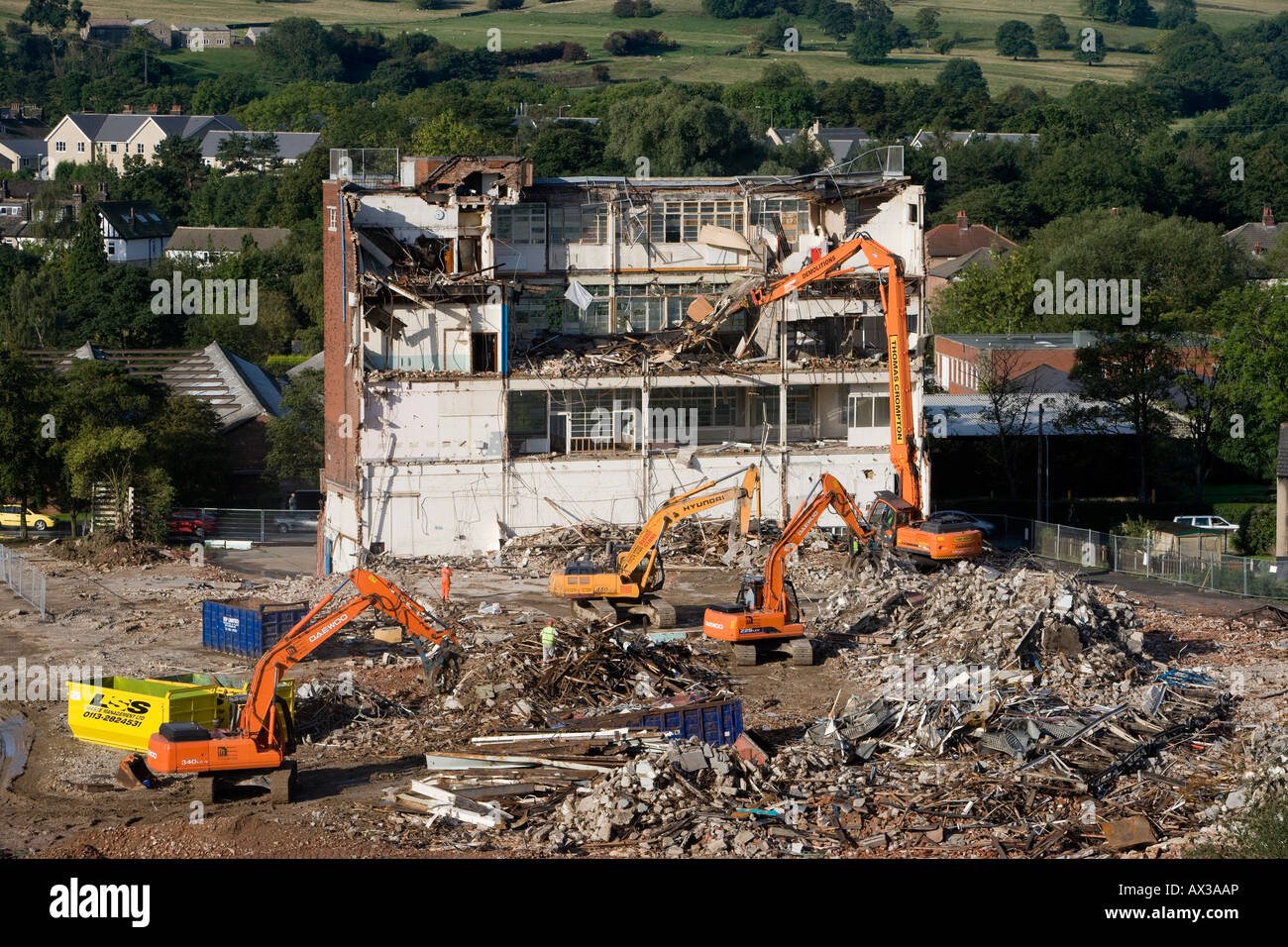 High view of demolition site (empty factory shell, heavy tracked ...